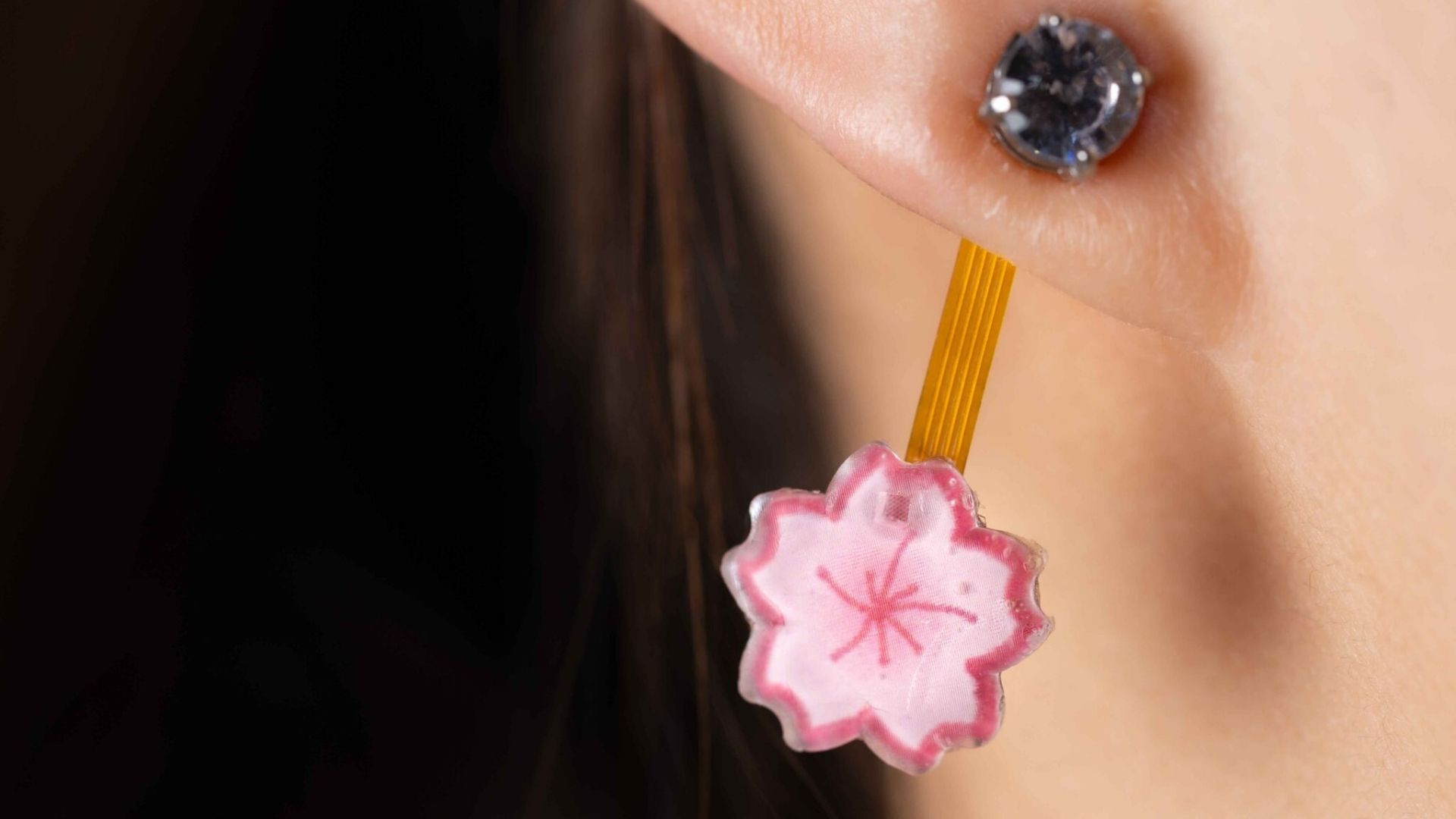 Researchers engineer tiny earrings to track stress, periods, and more