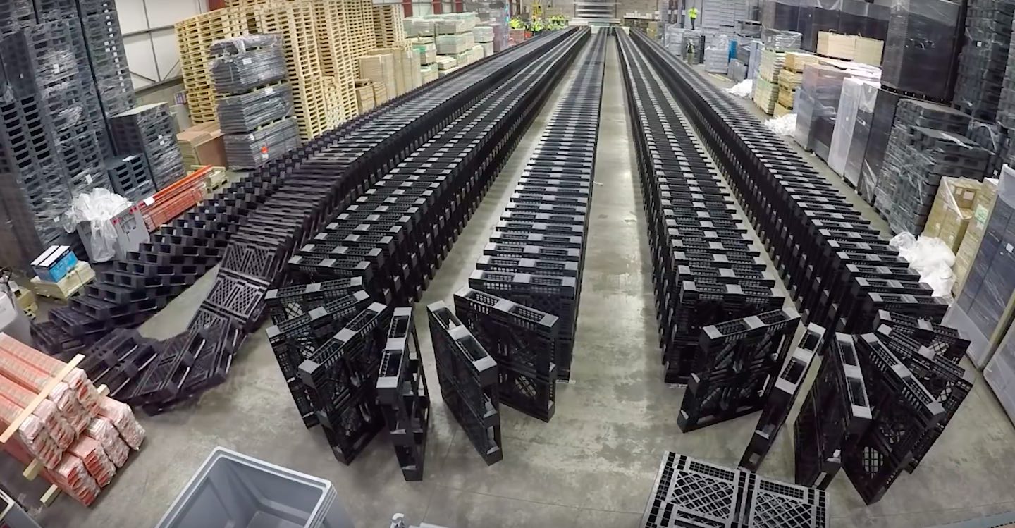 Watching These 1,377 Plastic Pallets Topple Like Dominoes Is Incredibly ...