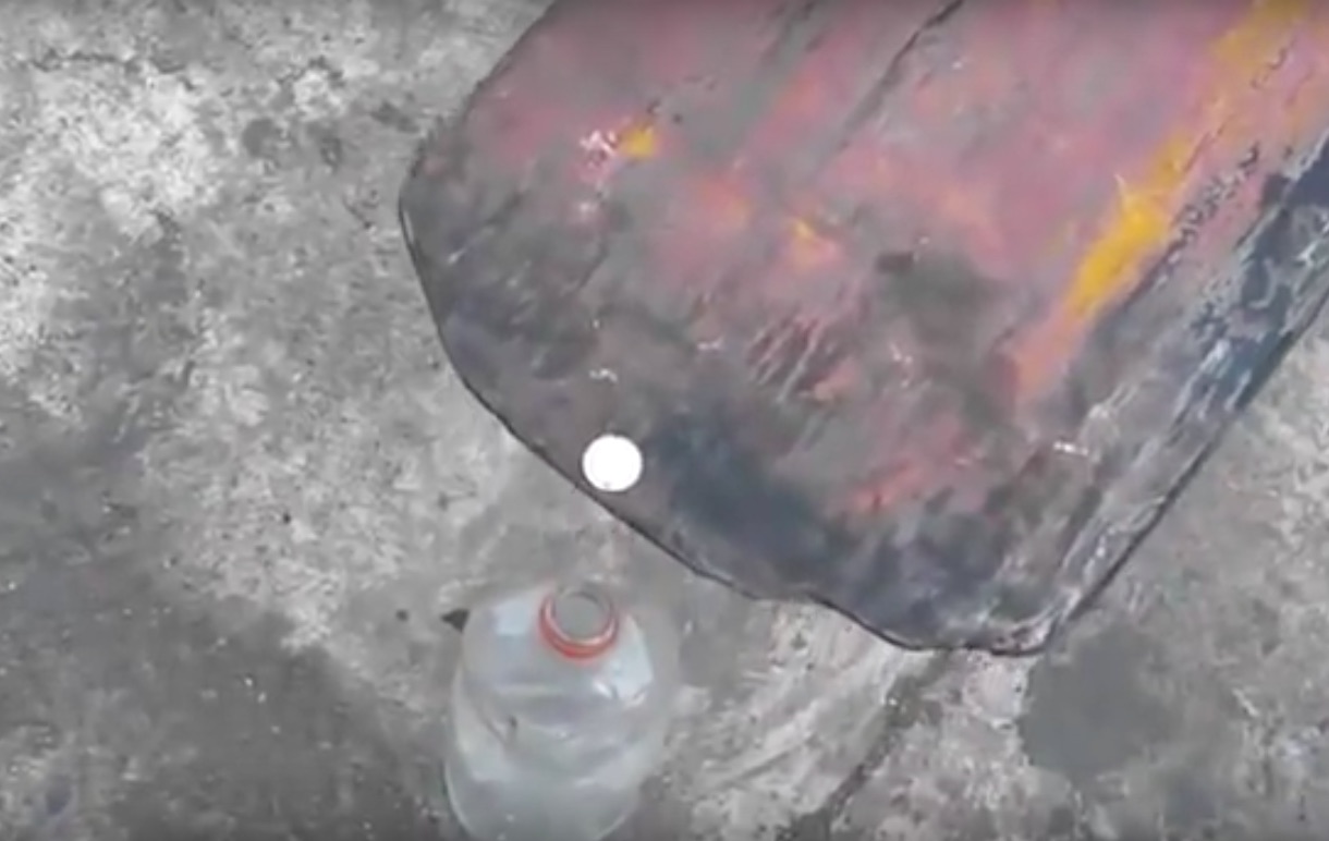 This Warehouse Driver Performs the Coin in a Bottle Trick Using a Forklift