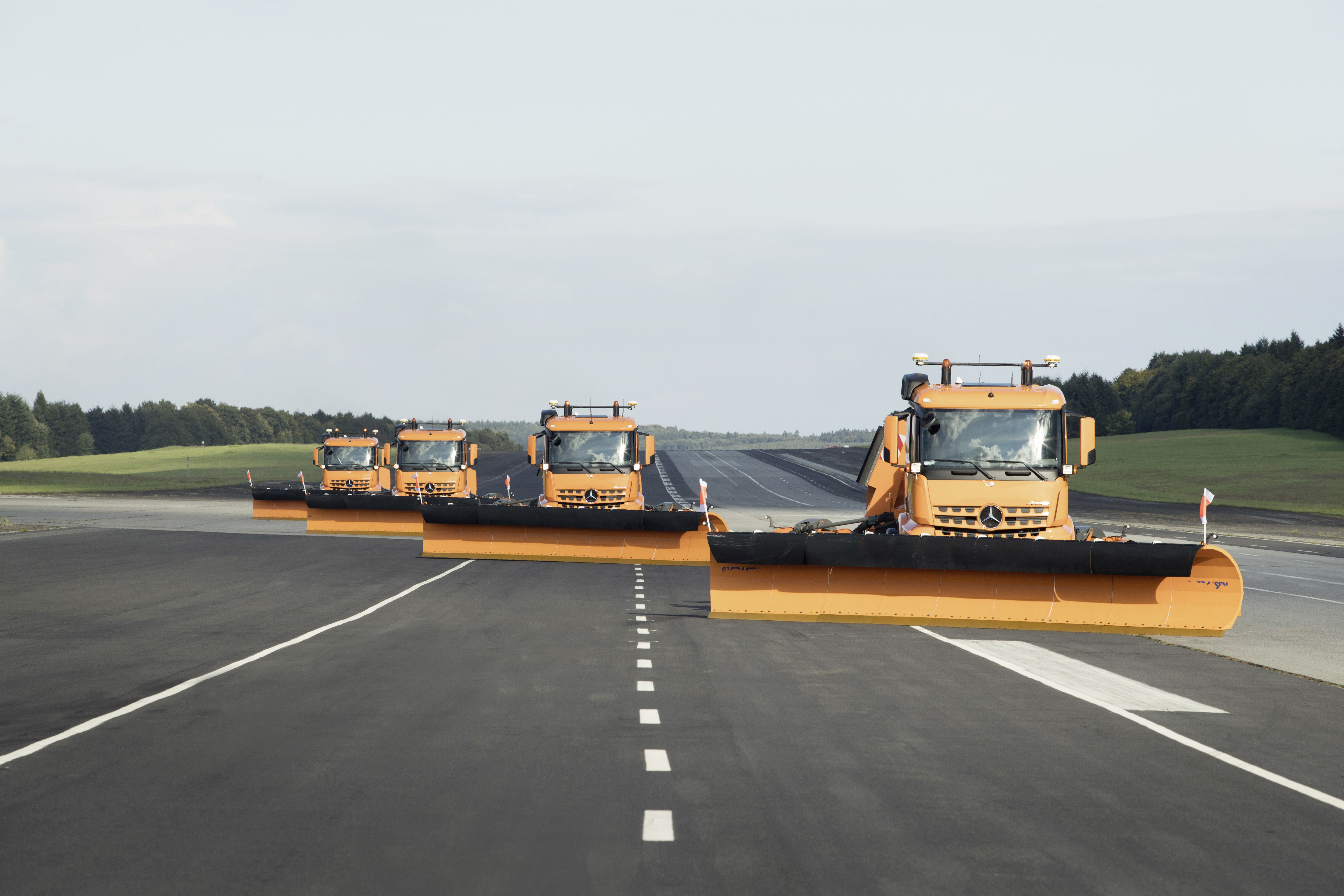 Daimler Has Revealed Its Fleet of Autonomous Snow Plow Trucks for Airports