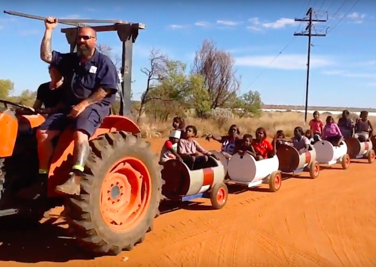 This DIY Barrel Train Ride Encourages Children to Go to School