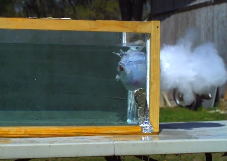 Shooting Liquid Metal Bullets into Water at High Speed
