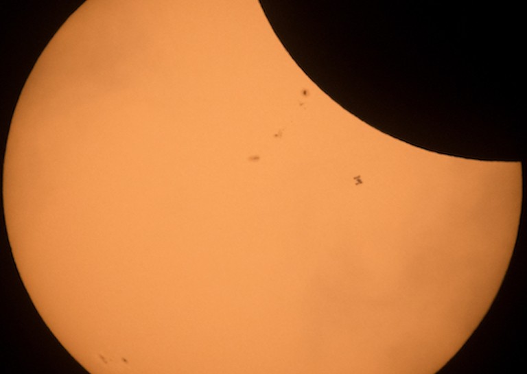 NASA Photographer Captures the Incredible Moment the ISS Flies Across ...