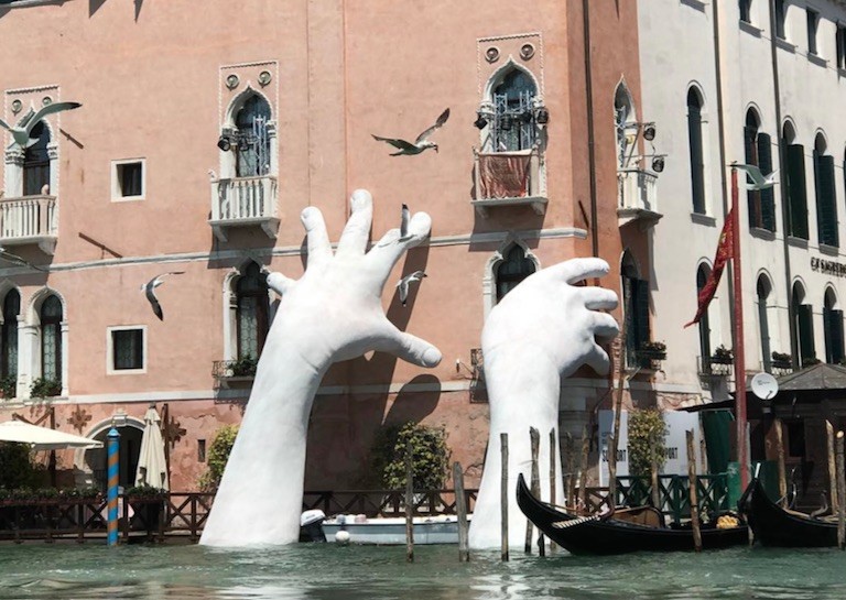 Artist Installs Giant Hand Sculptures in Venice Canal to Highlight ...