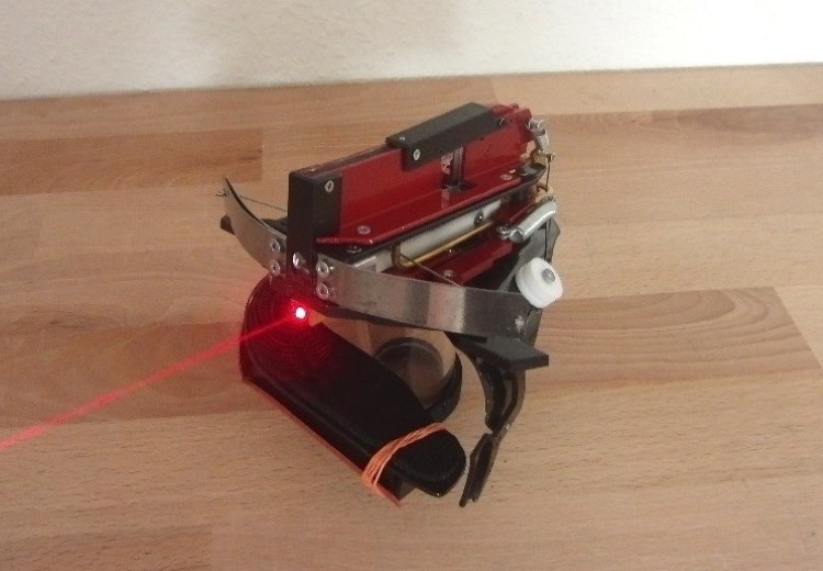 The semi-automatic wrist mounted crossbow with laser sighting