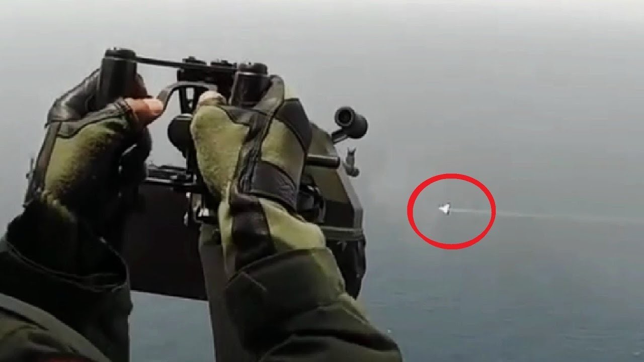 Helicopter Door Gunner Shoots Drone Out of Sky With His Machine Gun