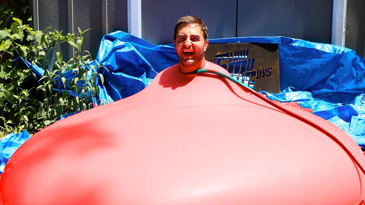 Giant Water Balloon Bursts with Man Inside in Slow Motion