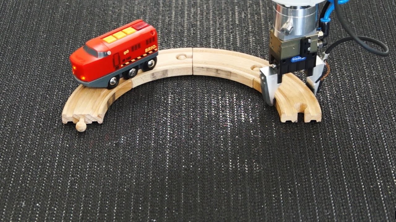 Watching This Robot Gripper Place Track for a Toy Train Is So Satisfying