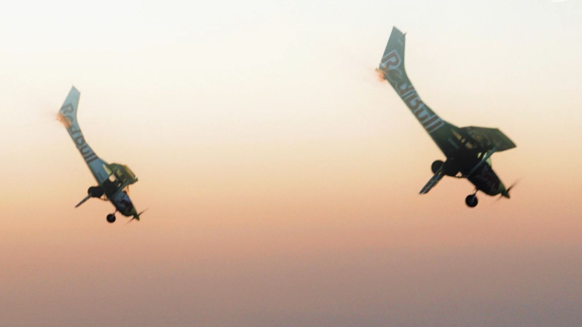 Mid-air plane swap stunt goes wrong after one plane spirals out of control