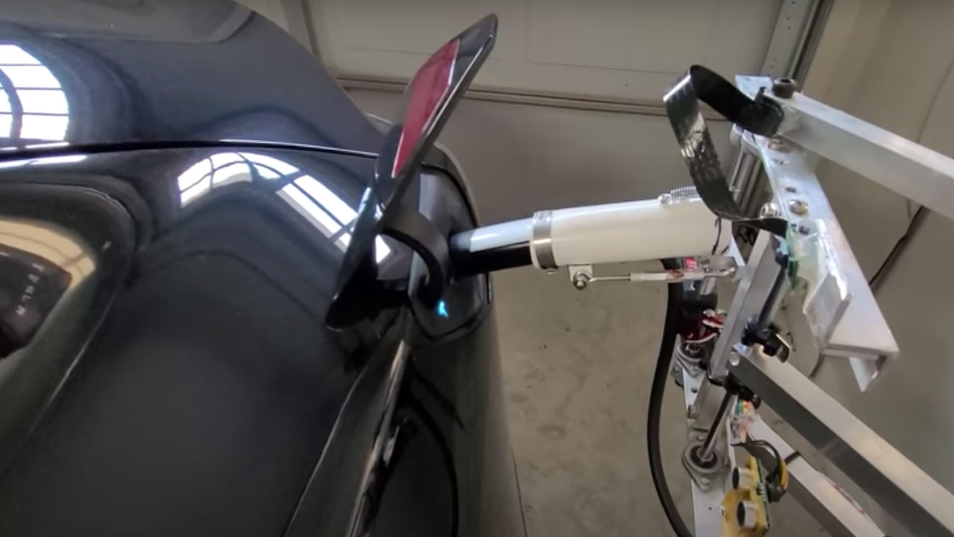 Tesla Owner Builds DIY EV Robotic Charger in His Garage