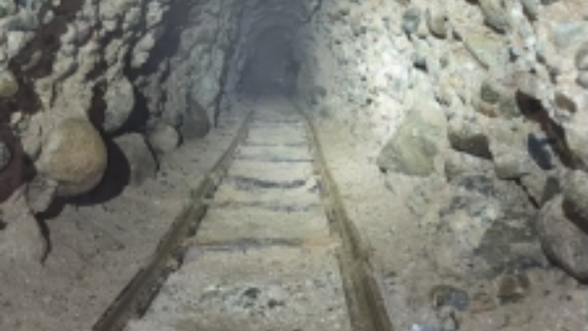 A tremendously long drug smuggling tunnel had tracks, electricity, and ...