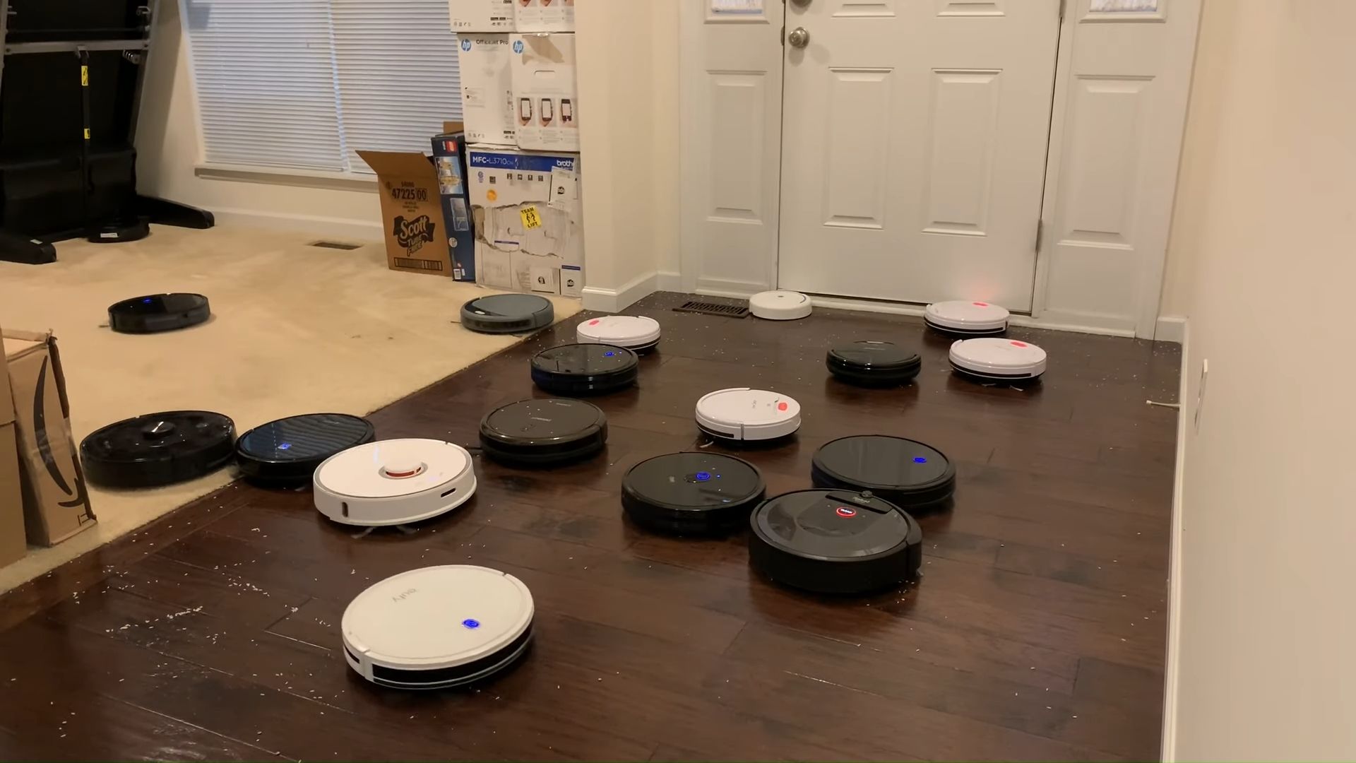 Watch 25 Robot Vacuums Attack A Bunch of Spilled Rice At Once