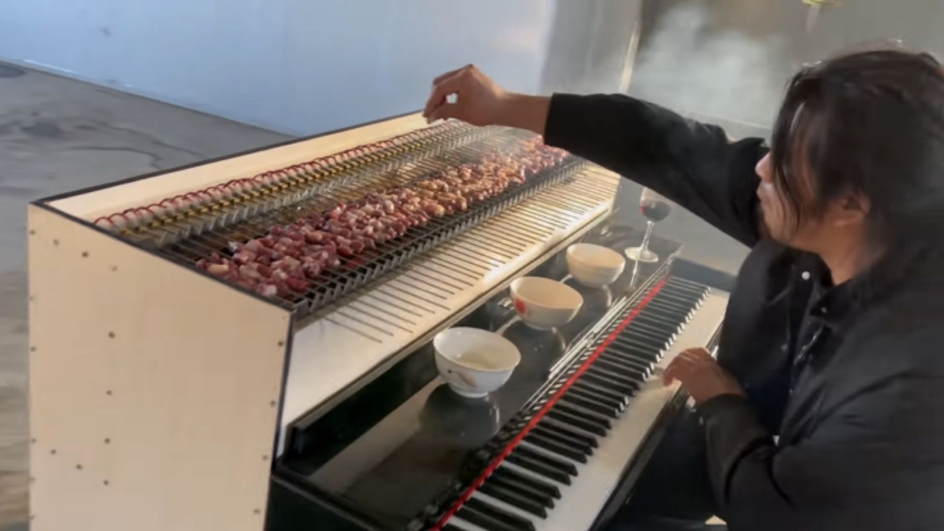 A creative genius builds piano BBQ car that plays music and cooks food